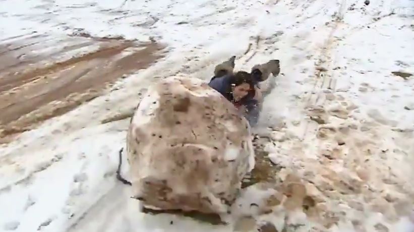 WATCH | Reporter sleds head-first into snowman | wkyc.com